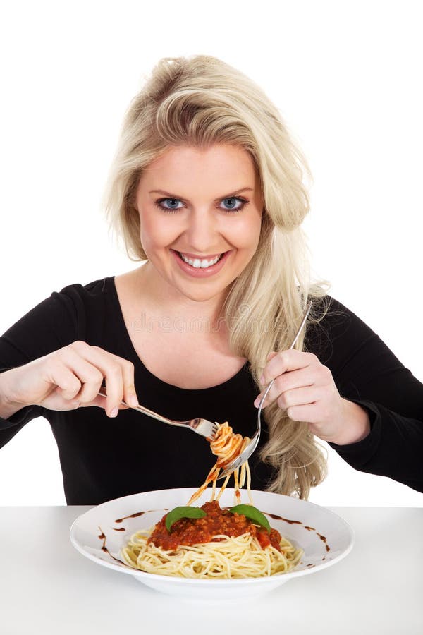 Woman eating pasta at cafe stock photo. Image of person - 5211208