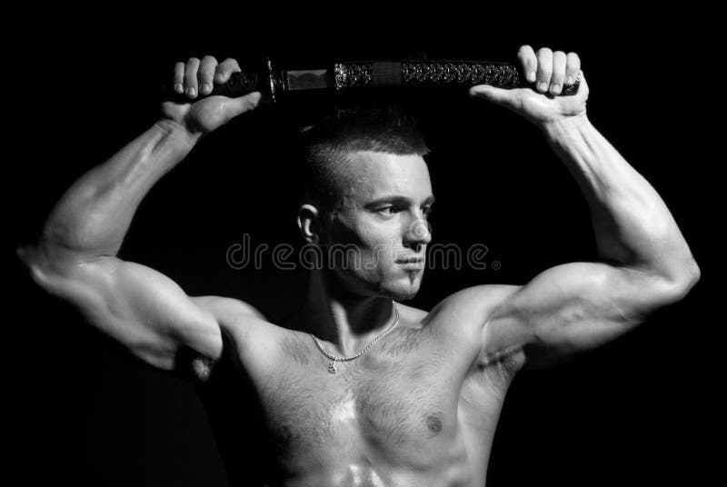 Model with sword stock photo. Image of muscle, muscular - 20252640