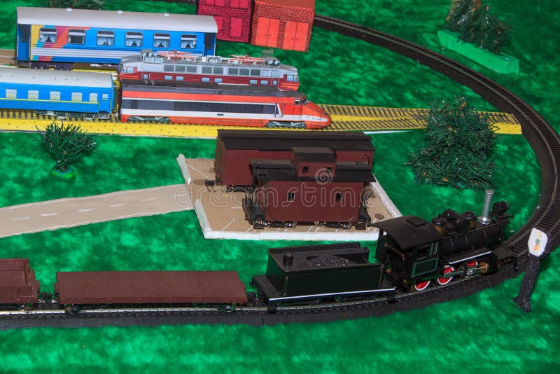 Model of a Toy Railway with a Cargo Train. Stock Photo - Image of tree ...