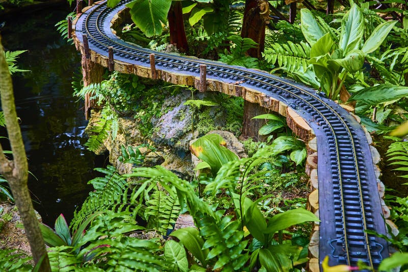 Model Train in Lush Garden Oasis Low Perspective View Stock Photo ...