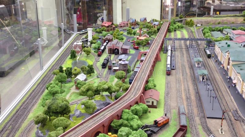 Model Train Set with a Green Bridge and a Red Train Stock Video - Video ...