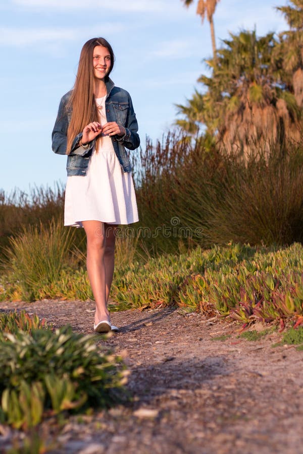 Model walking on foot path stock image. Image of happy - 75236659