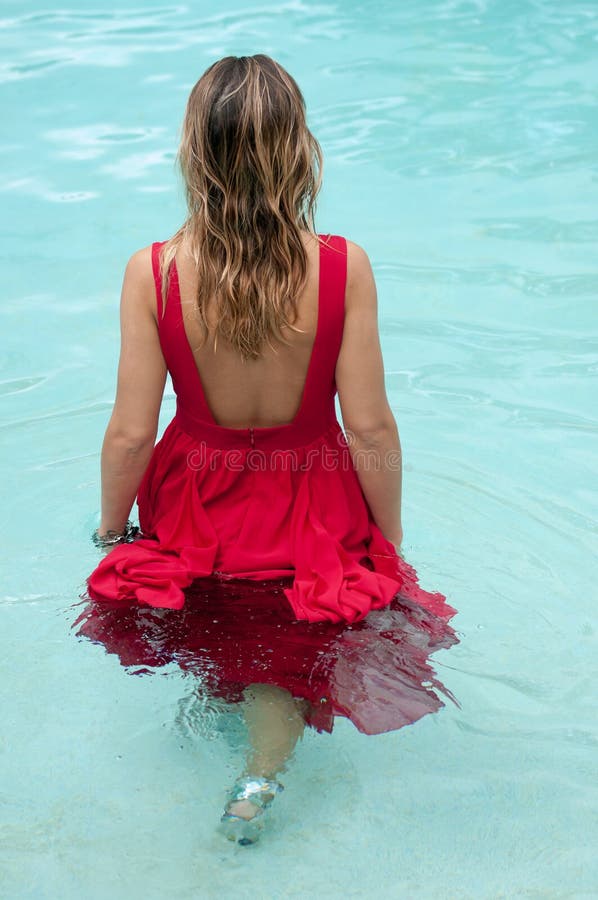 Blond Haired Model Wearing a Swimsuit at a Pool Stock Image - Image of ...