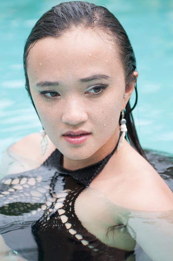 Dark Haired Model with Black Swimsuit at a Pool Stock Photo - Image of ...