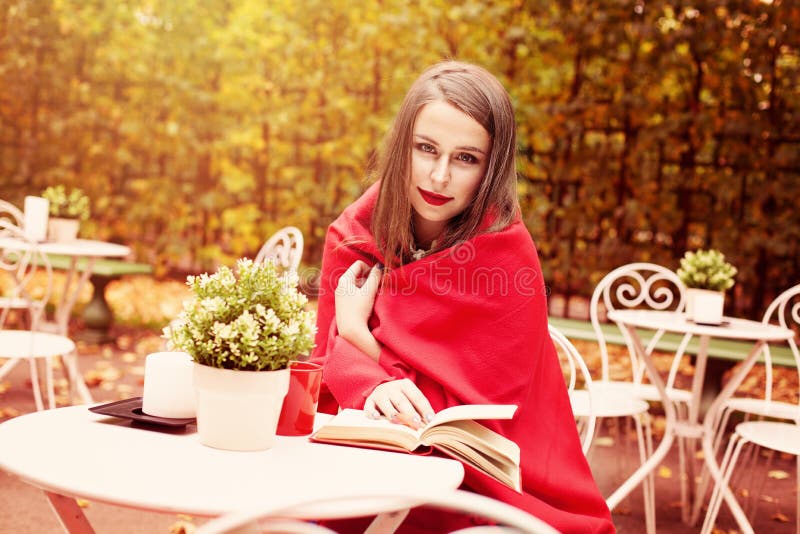 Model Woman Reading a Book in a Cafe Outdoors Stock Image - Image of ...