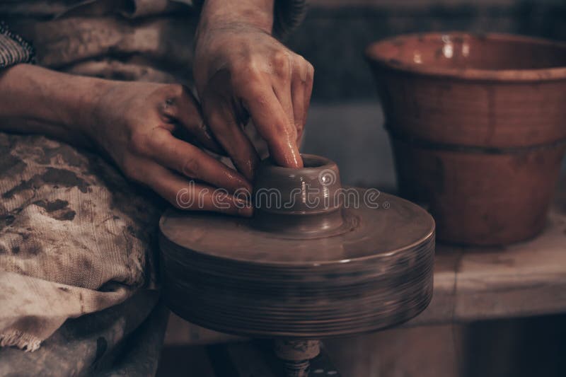 Modeling Bowl from Clay on Wheel in Pottery Workshop. Dirty Hands of ...