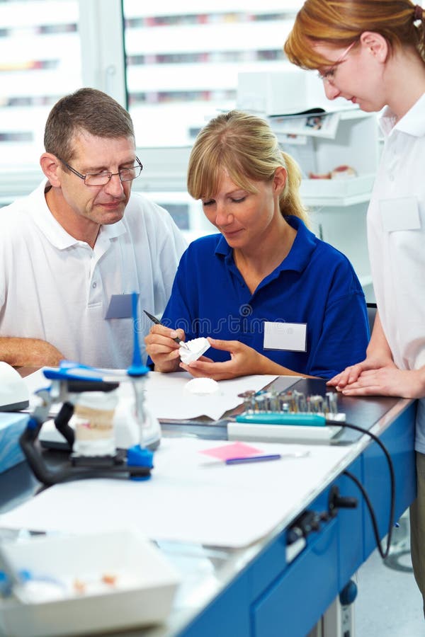 Explaining denture work stock image. Image of dentistry - 11773741