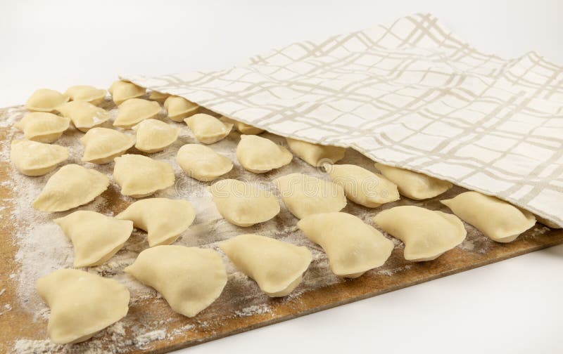 Modelling Dumplings. a Board with Dumplings is Half Covered with a ...