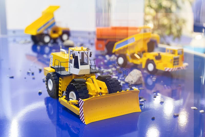 Models of Bulldozer and Other Mining Equipment at the Exhibition Stand ...