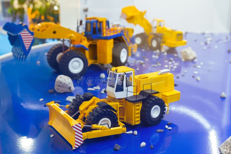 Models of Bulldozer and Other Mining Equipment at the Exhibition Stand ...