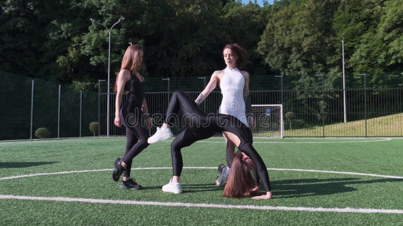 The Models Showcase a Variety of Acrobatic Poses and Demonstrate ...