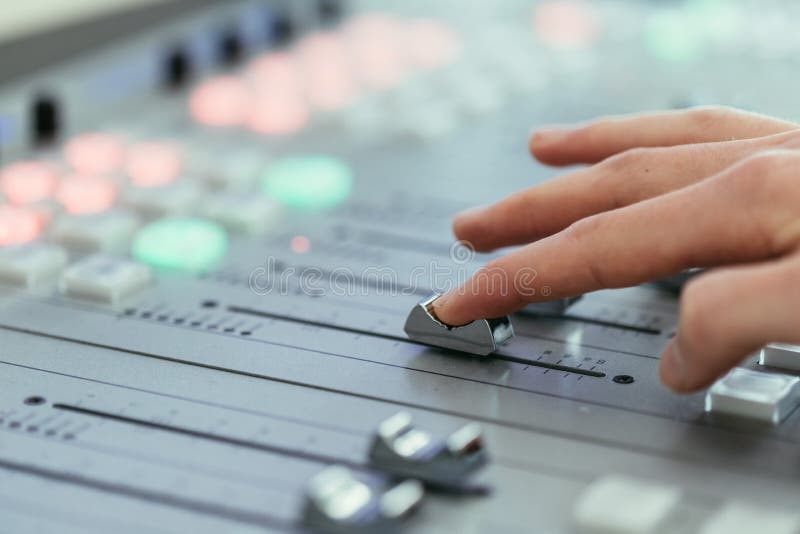 Radio Broadcasting Studio: Moderator is Using the Soundboard, Computer ...