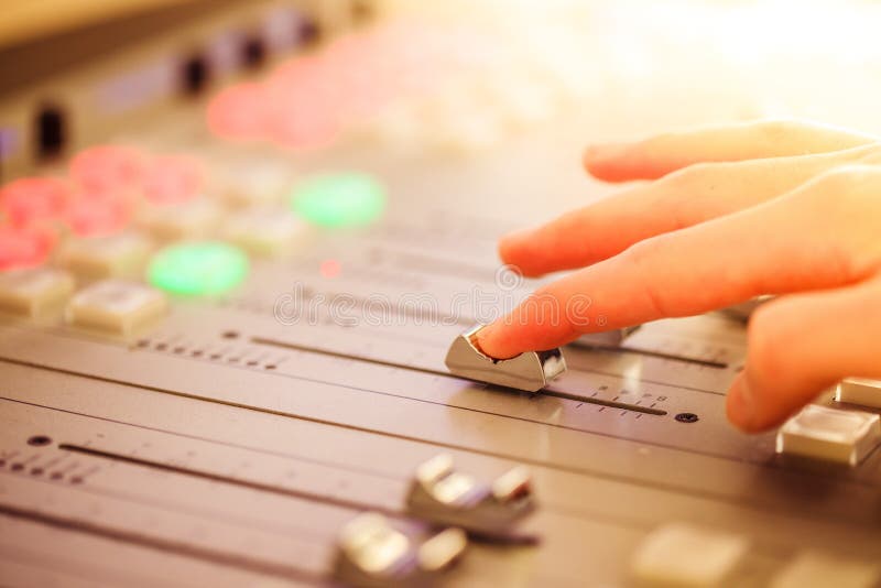 Radio Broadcasting Studio: Moderator is Using the Soundboard, Computer ...
