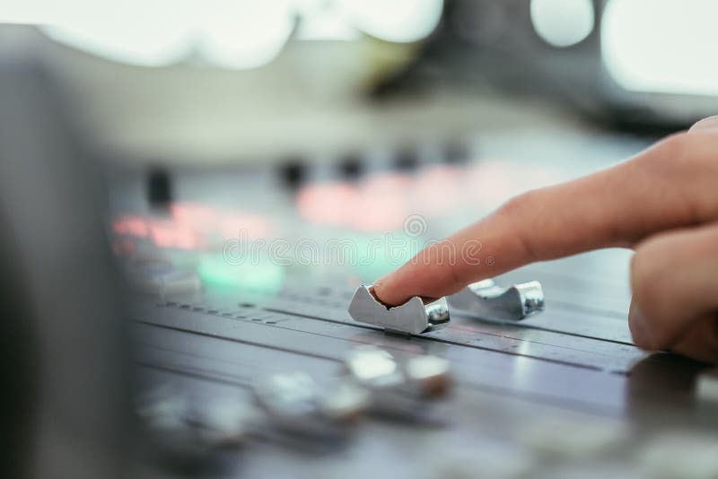 Radio Broadcasting Studio: Moderator is Using the Soundboard, Computer ...