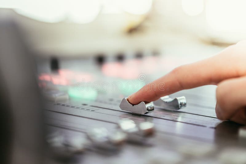 Radio Broadcasting Studio: Moderator is Using the Soundboard, Computer ...