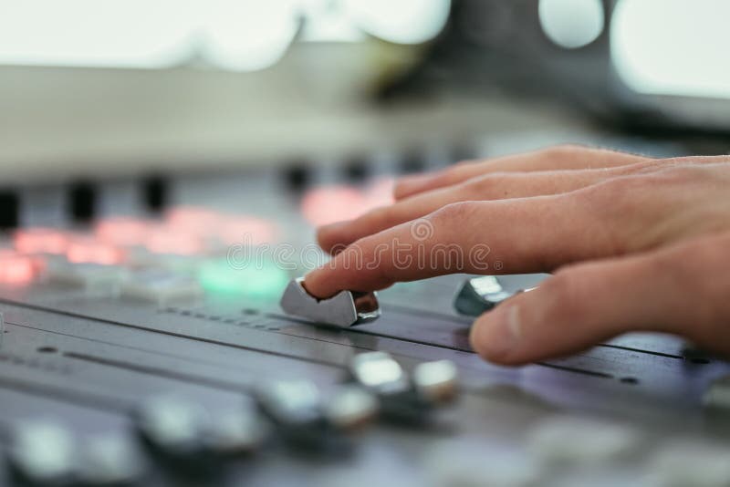 Radio Broadcasting Studio: Moderator is Using the Soundboard, Computer ...