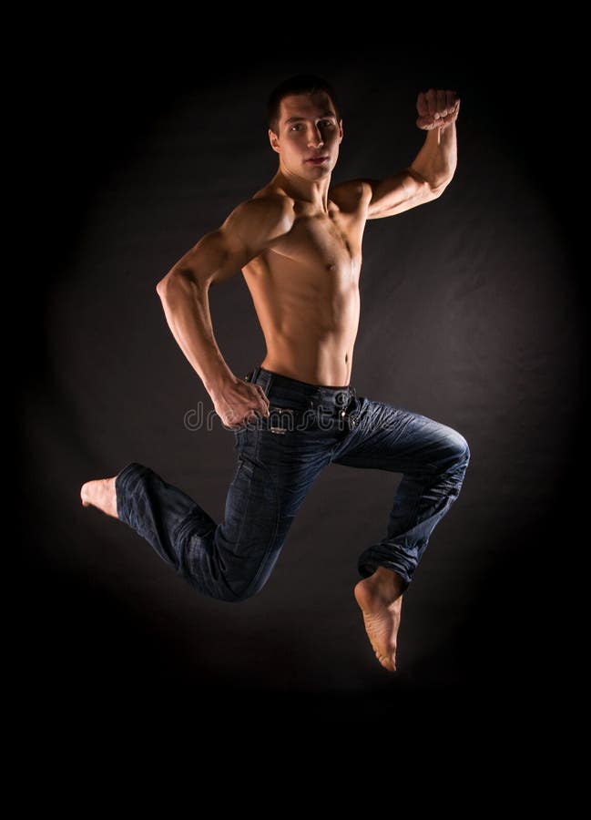 Acrobat Dancer Toned in Gold Posing Over Black Background Stock Image ...
