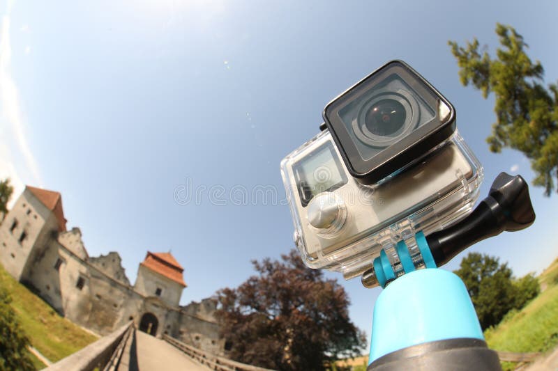 Modern Action Camera with Monopod Outdoors. Fisheye Lens Effect Stock ...
