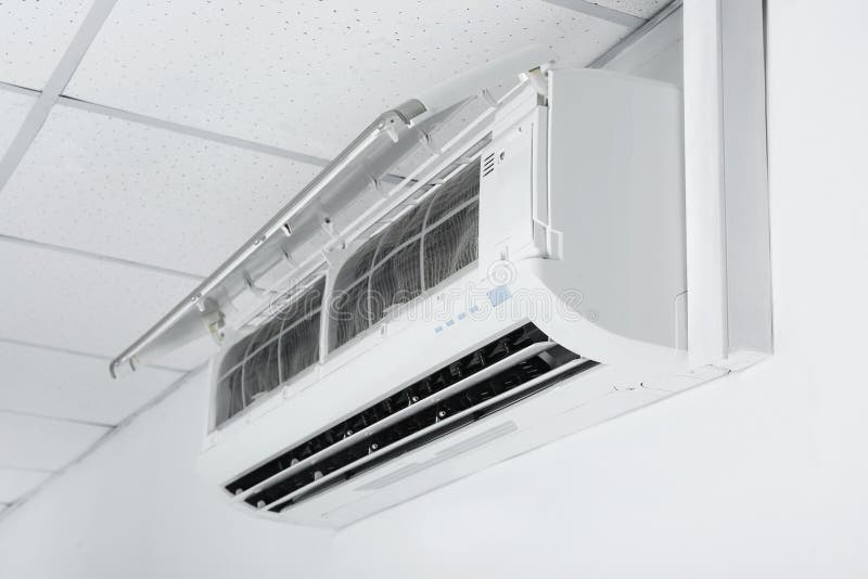 Modern Air Conditioner Hanging on White Wall Stock Photo - Image of ...