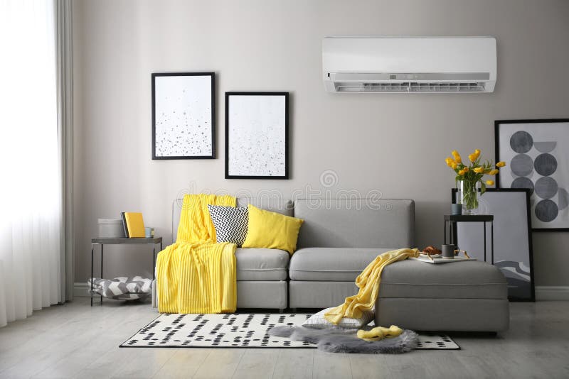 Modern Air Conditioner on Light Grey Wall in Living Room with Stylish ...