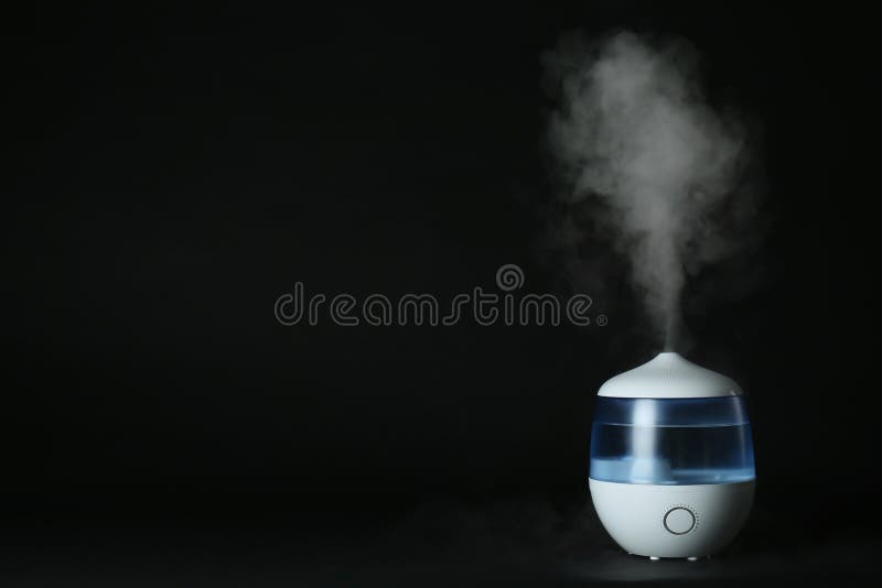 Air Humidifier on Black Background. Space for Text Stock Image - Image ...