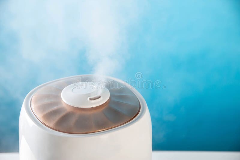 Modern Air Humidifier on a Blue Background. Humidification in the Room ...