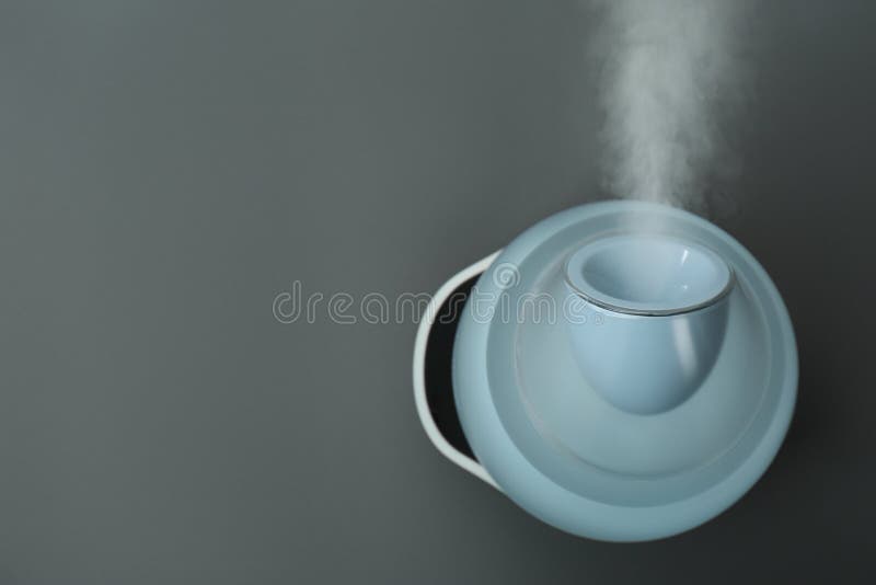 Modern Air Humidifier on Grey Background, Top View. Space for Text ...