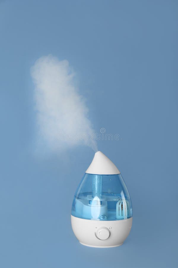 Modern Air Humidifier on Light Blue Background Stock Photo - Image of ...