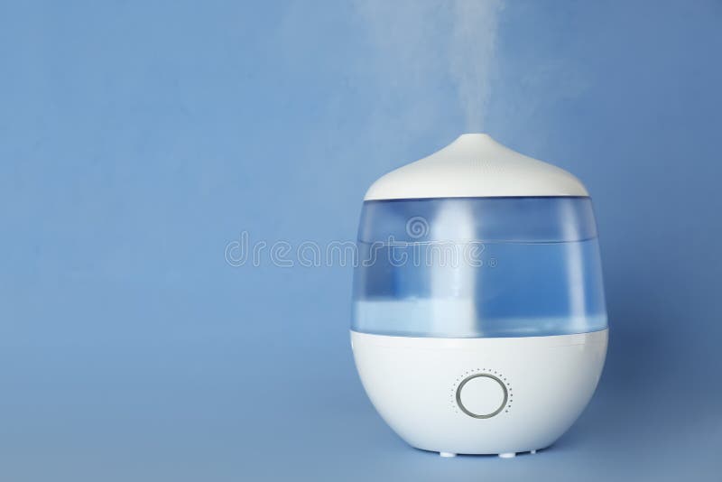 Modern Air Humidifier on Blue Background. Space for Text Stock Image ...