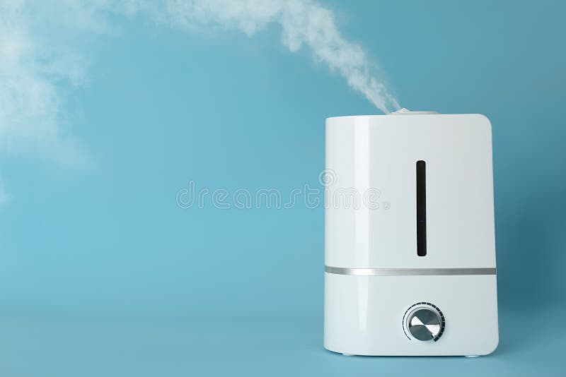 Air Humidifier on Light Blue Background. Space for Text Stock Photo ...
