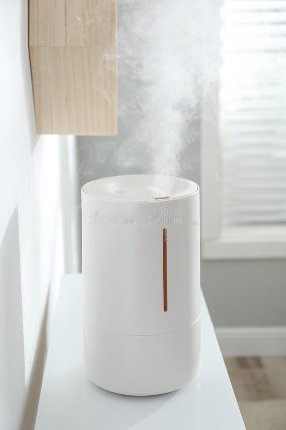 Modern Air Humidifier on Table at Home Stock Photo - Image of domestic ...