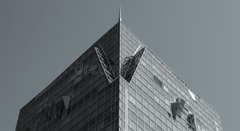 A Modern, Angular Skyscraper Dominated by a Grid of Reflective Glass ...