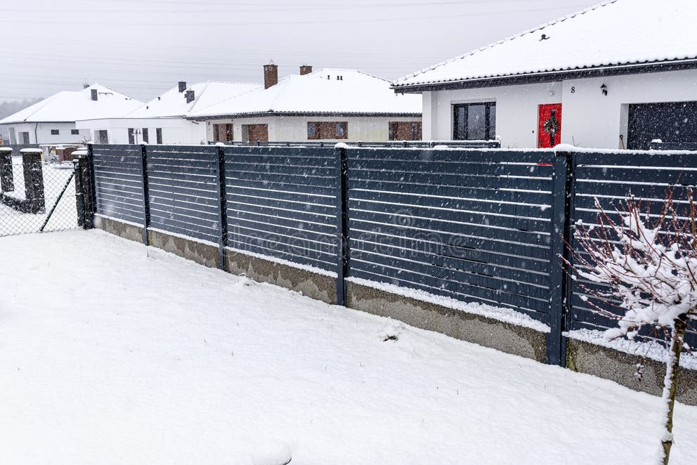 Modern Anthracite Panel Fence with Falling Smeared Snow during a ...