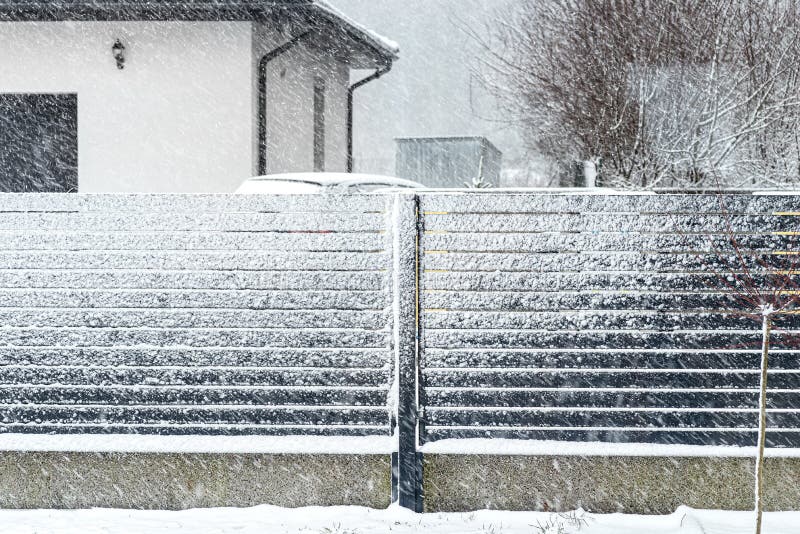 Modern Anthracite Panel Fence with Falling Smeared Snow during a ...