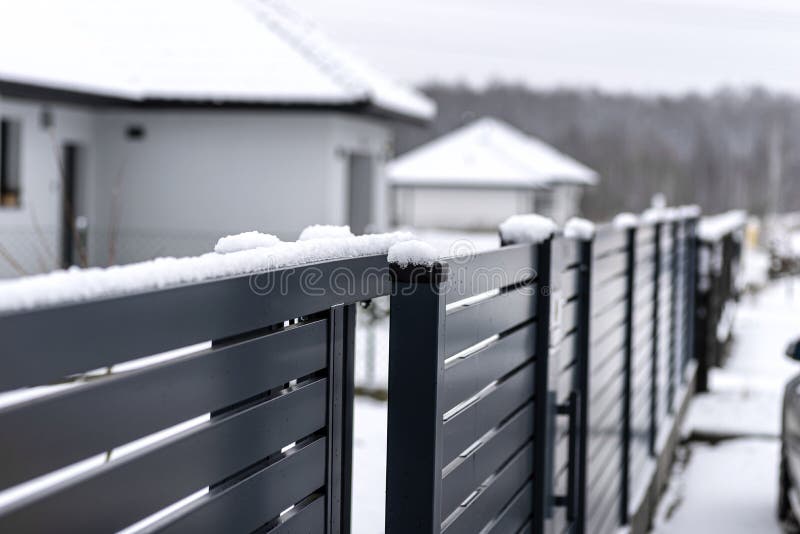 Modern Anthracite Panel Fence with Falling Snow, Visible Sliding Gate ...