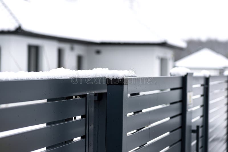 Modern Anthracite Panel Fence with Falling Snow, Visible Sliding Gate ...