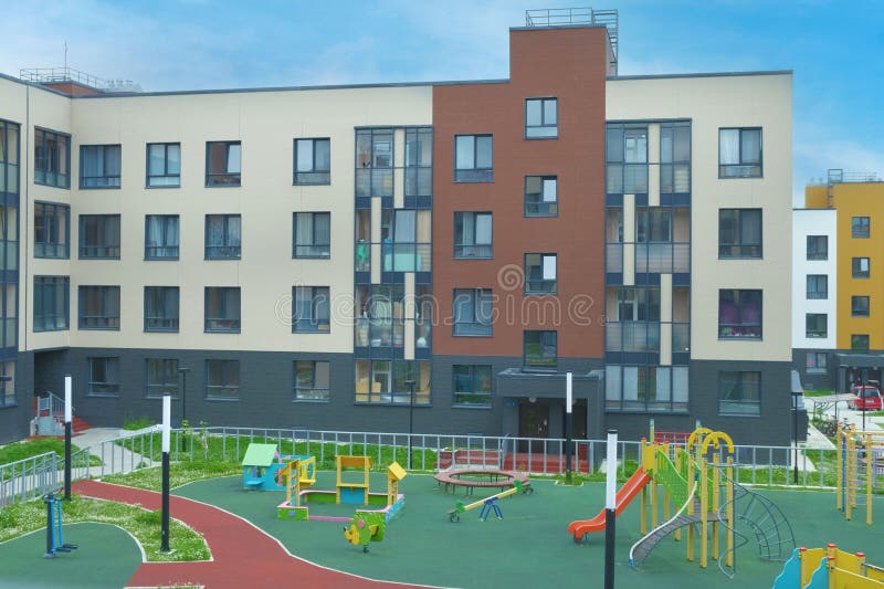 Modern Apartment Building with Colorful Playground Stock Image - Image ...