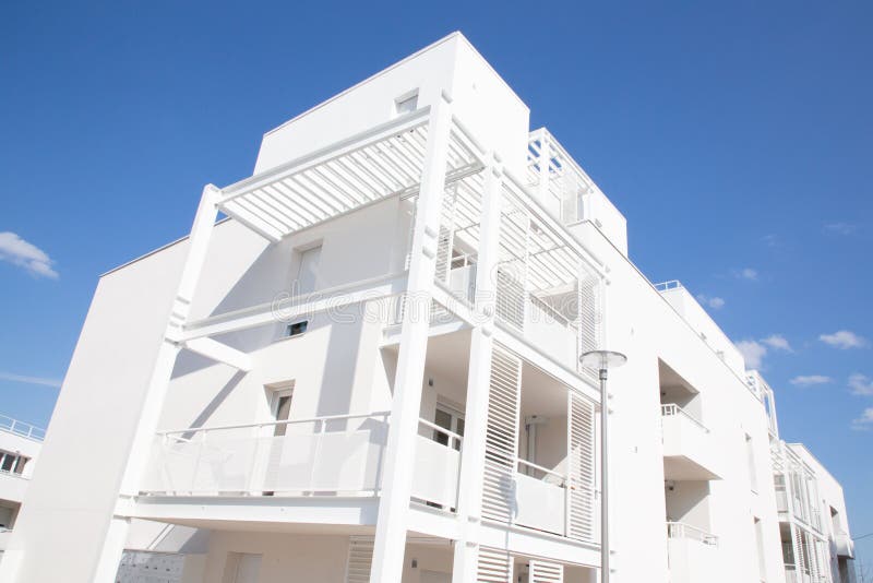 Modern Apartment Building Facade on Blue Sky Stock Photo - Image of ...