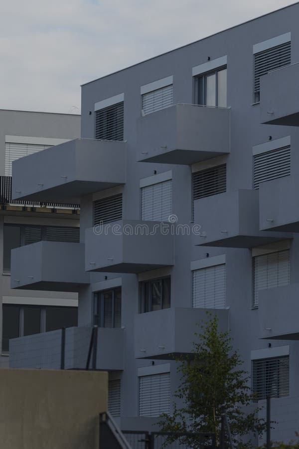 A Modern Apartment Building Featuring Unique and Stylish Balconies Stock Photo - Image of urban ...