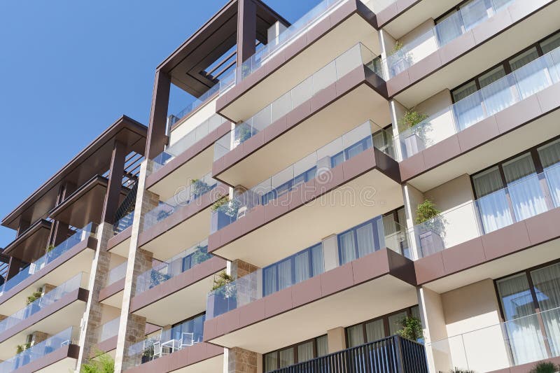 Modern Apartment Building with Glass Railing Balcony Stock Image ...
