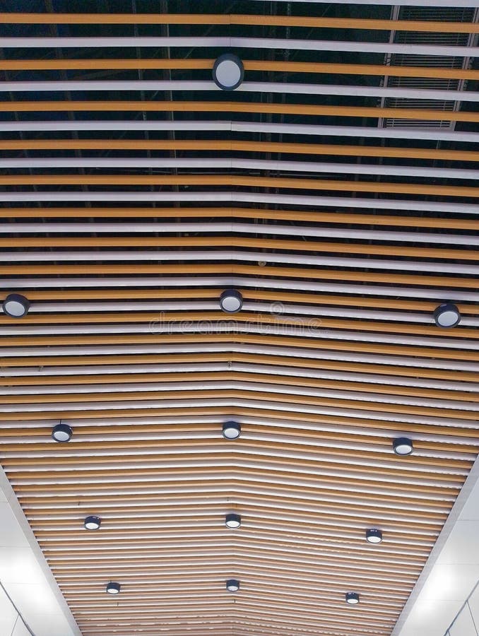 Modern Architectural Ceiling with Geometric Slats and Lighting Pattern ...