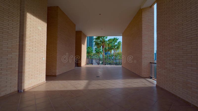 Modern Architectural Corridor Bathed in Natural Light and Overlooking a ...