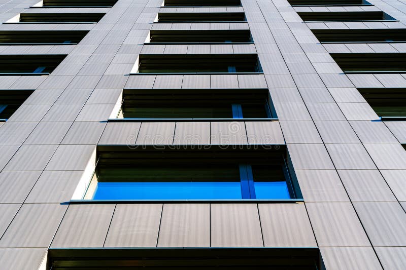 Modern Architectural Facade with Geometric Protrusions and Reflective ...