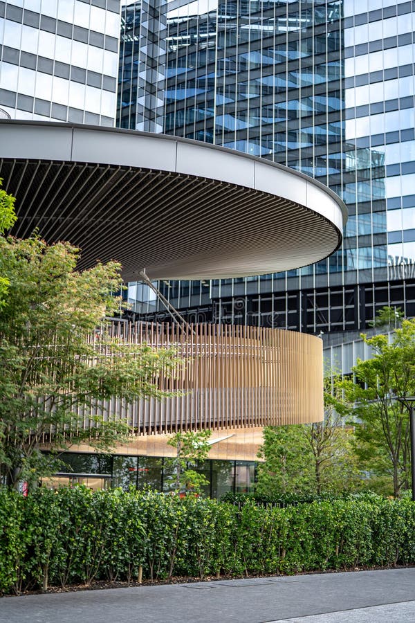 Gate Lanthanum Spiral Framed by Trees with Pedestrian Walkway in Osaka ...