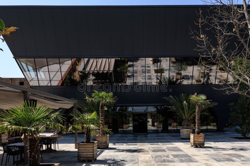 Modern Architecture with Black Facade and Glass Windows in Tropical ...