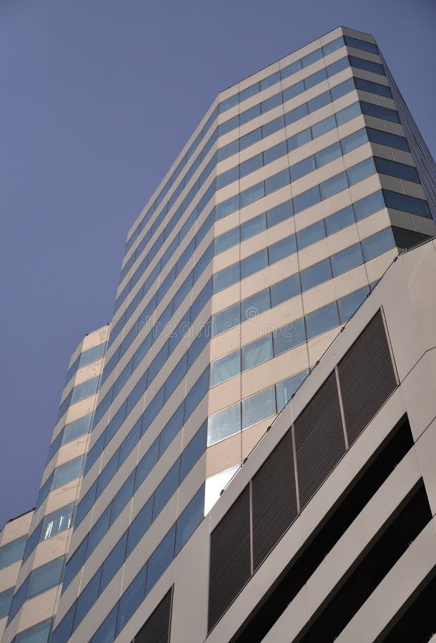 Modern Building Soaring into Blue Sky Stock Image - Image of building ...