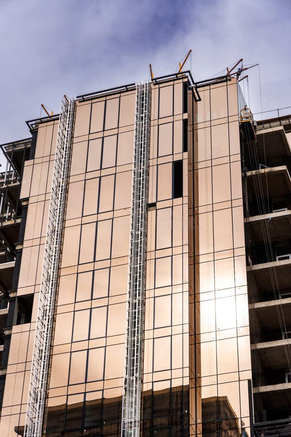Modern Architecture in Progress with Exterior Lifts. Awesome Scene with ...