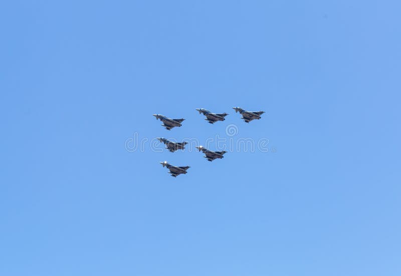 Modern Armed Military Fighter Jets Flys in Formation through the Sky ...
