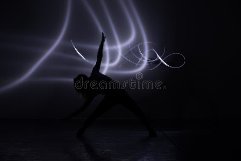 Modern Art Dancer, Dancing in Front of a Black Background with Neon ...