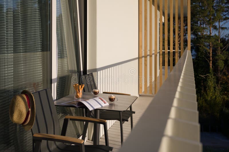 Modern Balcony with Table, Chairs, and Coffee Stock Image - Image of ...